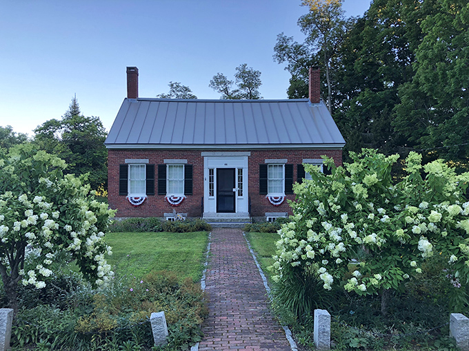 This charming brick cottage with patriotic bunting embodies the affordable New England dream&mdash;hydrangeas included, mortgage anxiety not.