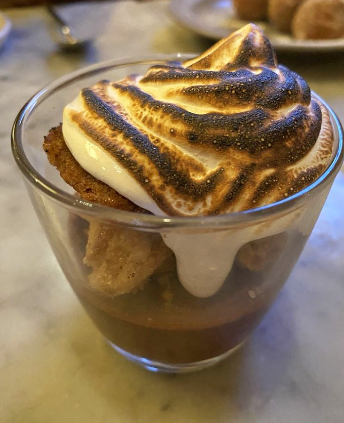 This s'mores-inspired dessert brings campfire nostalgia to sophisticated heights. That torched meringue top is pure culinary theater.