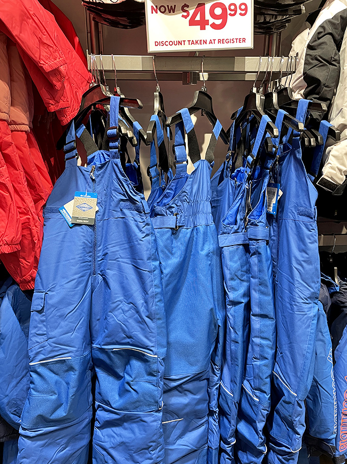Snow pants hanging like blue sentinels, ready to transform winter from something you endure into something you conquer&mdash;at nearly half the usual price.