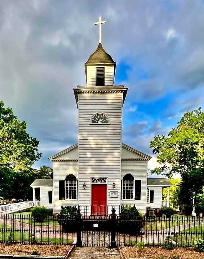 St. Paul's Church, with its striking white clapboard and red door, has been witnessing weddings, funerals, and everything in between since 1822.