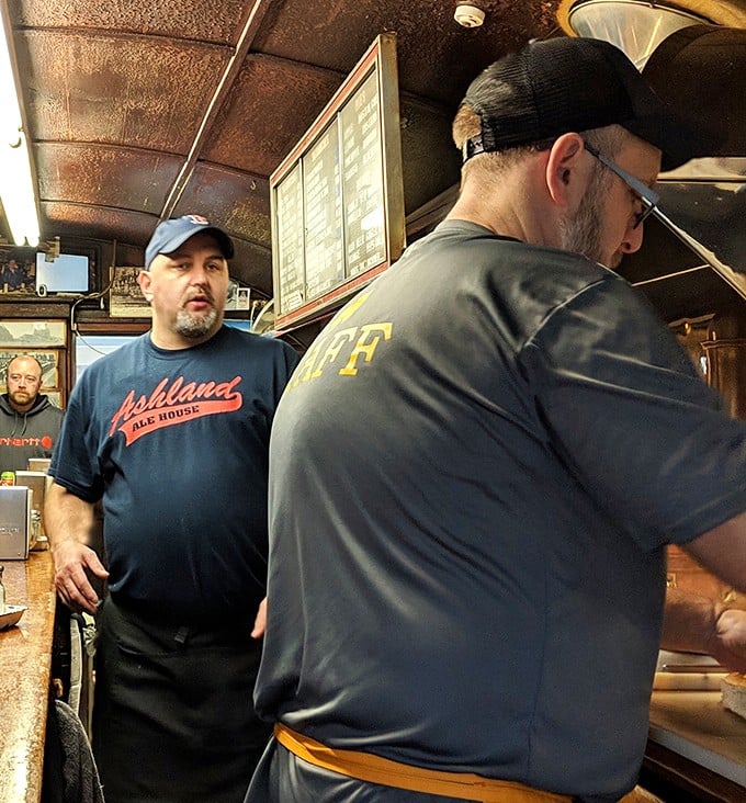 Behind the counter, where the magic happens. The choreography of short-order cooking in such a compact space is nothing short of miraculous.