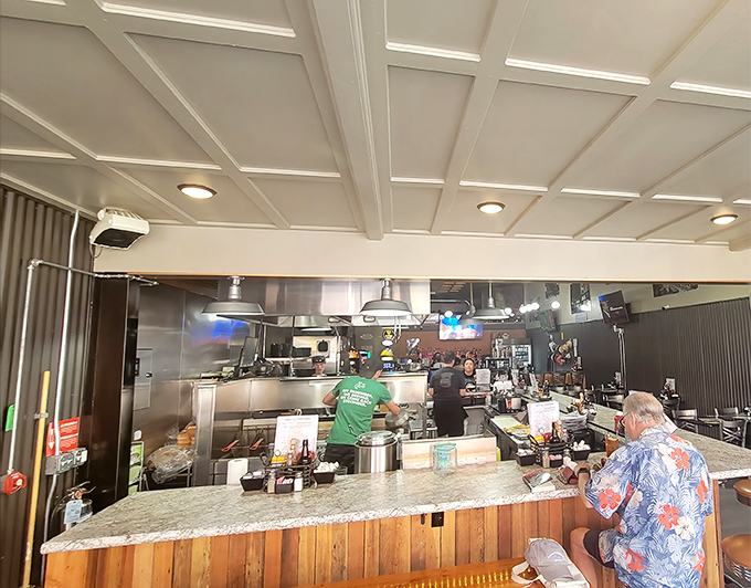 The open kitchen concept before it was trendy – watch as your breakfast transforms from ingredients to masterpiece right before your eyes.