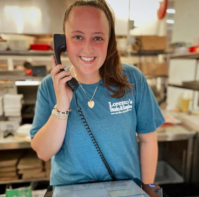 Taking orders with a smile—Lorenzo's staff understands they're not just making sandwiches, they're creating happiness between bread.