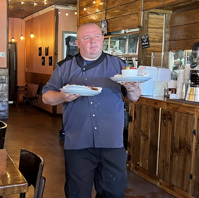 The staff moves with purpose, balancing multiple plates with the confidence of someone who knows they're delivering happiness to hungry patrons.