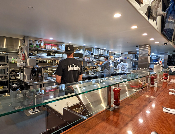 Behind every great seafood dish is a kitchen crew that knows their way around the ocean's bounty. The Modelo shirt suggests good taste extends to beer selection too.