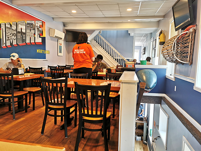 The dining room's blue walls and Baltimore pride create the perfect atmosphere for indulging in the city's most beloved culinary tradition.