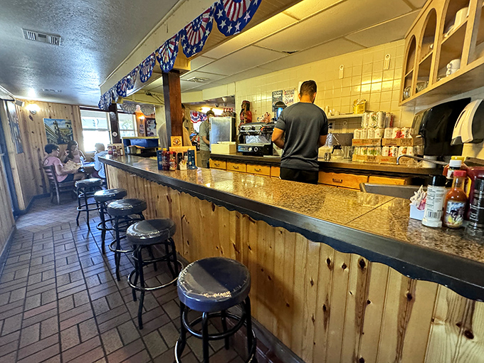 The bar area offers front-row seats to the kitchen action. Those stools have supported generations of happy diners waiting for their Cuban coffee fix.