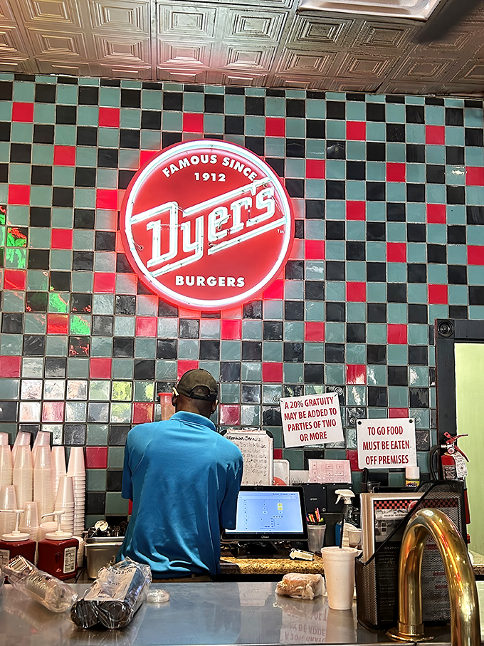 That red and green checkerboard wall isn't just decoration &ndash; it's a backdrop for burger greatness that's been "Famous Since 1912."