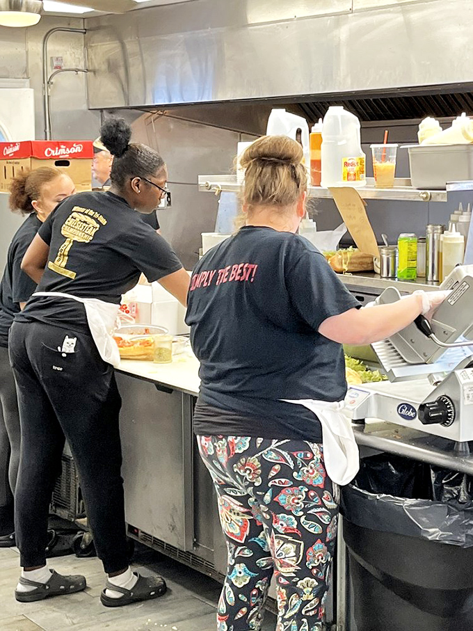Behind every legendary sandwich is a team of dedicated professionals. Their t-shirts say it all: "Simply The Best!"