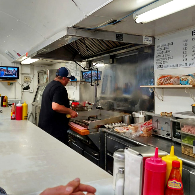 Where the magic happens. The grill master orchestrates a symphony of sizzles and flips that would make any food lover's heart skip a beat.