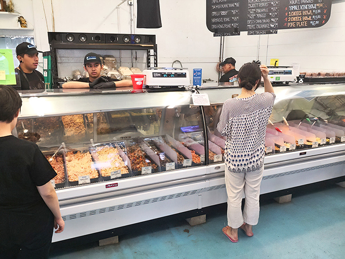 Staff members work with the precision of surgeons and the creativity of artists behind that gleaming counter.