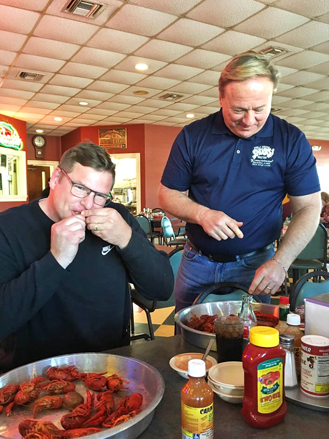 The sacred ritual of crawfish education&mdash;where locals patiently teach newcomers the art of "pinch, twist, suck, peel" with evangelical fervor.