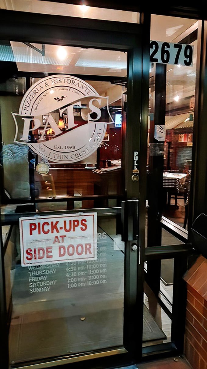 The front door promises "PICK-UPS AT SIDE DOOR"&mdash;a small detail that speaks volumes about a place that knows exactly what it is.