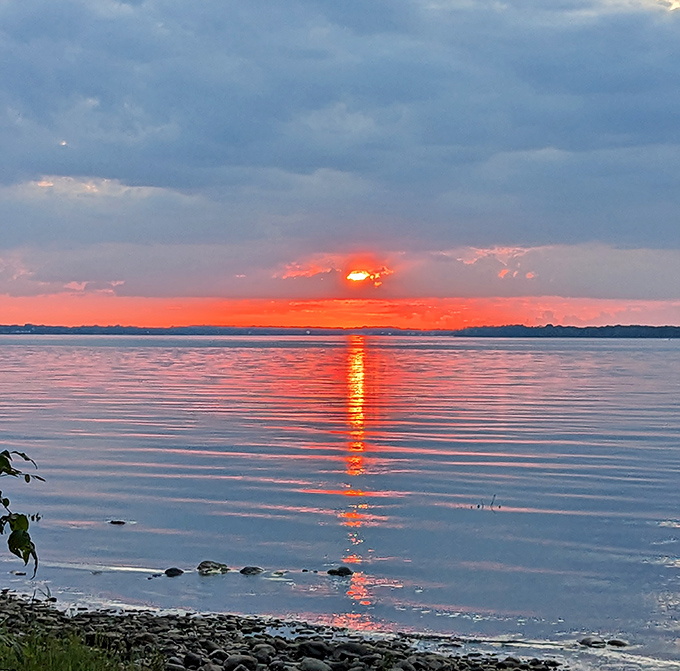 Sunset paints the water in colors that make you forgive every mosquito bite you've ever received.
