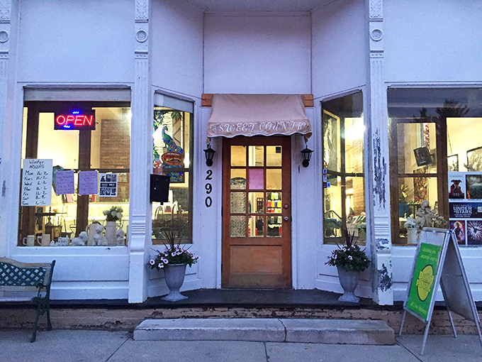 Sweet Country Cream's storefront glows with welcoming warmth, like your grandmother's kitchen if she had really good taste in signage.