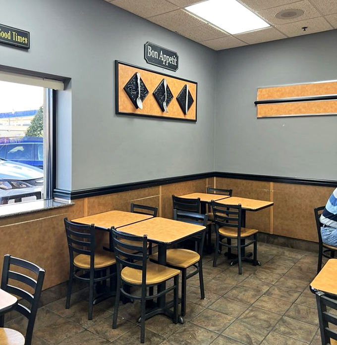 The casual seating area says "come as you are" while the "Bon Appétit" sign promises you'll leave significantly happier than you arrived.