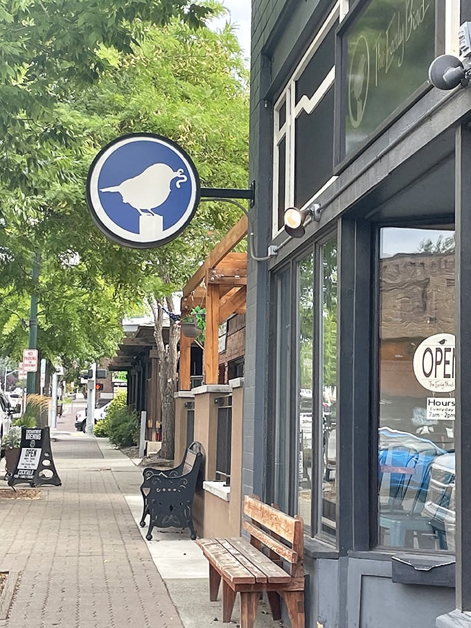 The Early Bird advertises wine through its window, because sometimes breakfast needs a sophisticated upgrade from just coffee alone.