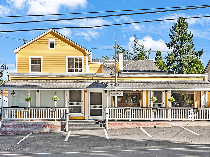 Sunshine yellow and welcoming porches—this isn't just lodging, it's a snapshot of simpler times with modern plumbing.