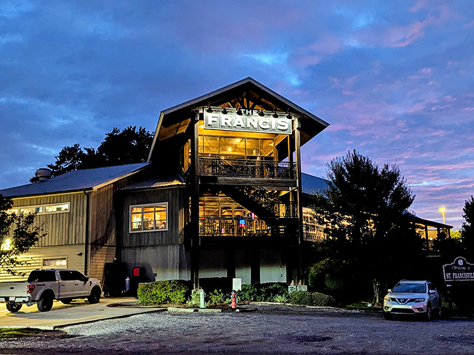 The Francis glows like a beacon of Southern hospitality as twilight falls. That sunset seems custom-ordered to complement the restaurant's warm lighting.