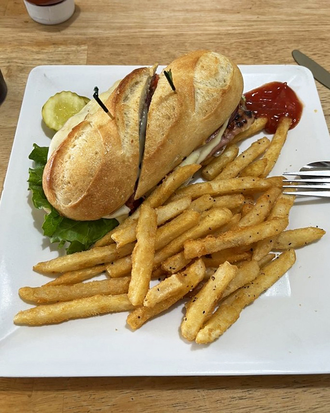 The Godfather of sandwiches, an offer your taste buds can't refuse, escorted by golden fries that deserve their own protection detail.