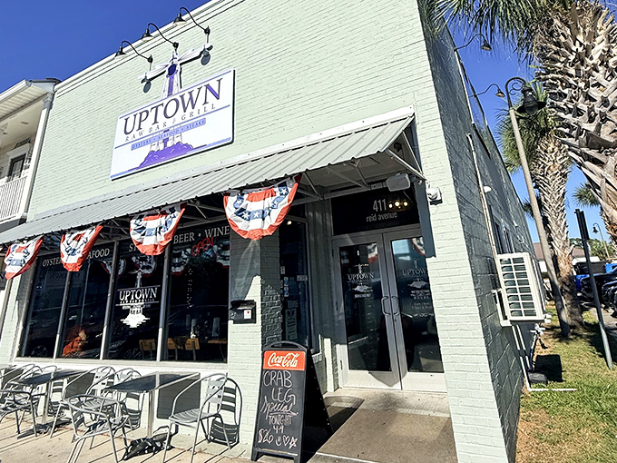 Uptown Raw Bar & Grill's mint-green facade and sidewalk seating beckons like an old friend saying, "Come on in, the seafood's fine and the beer's cold."