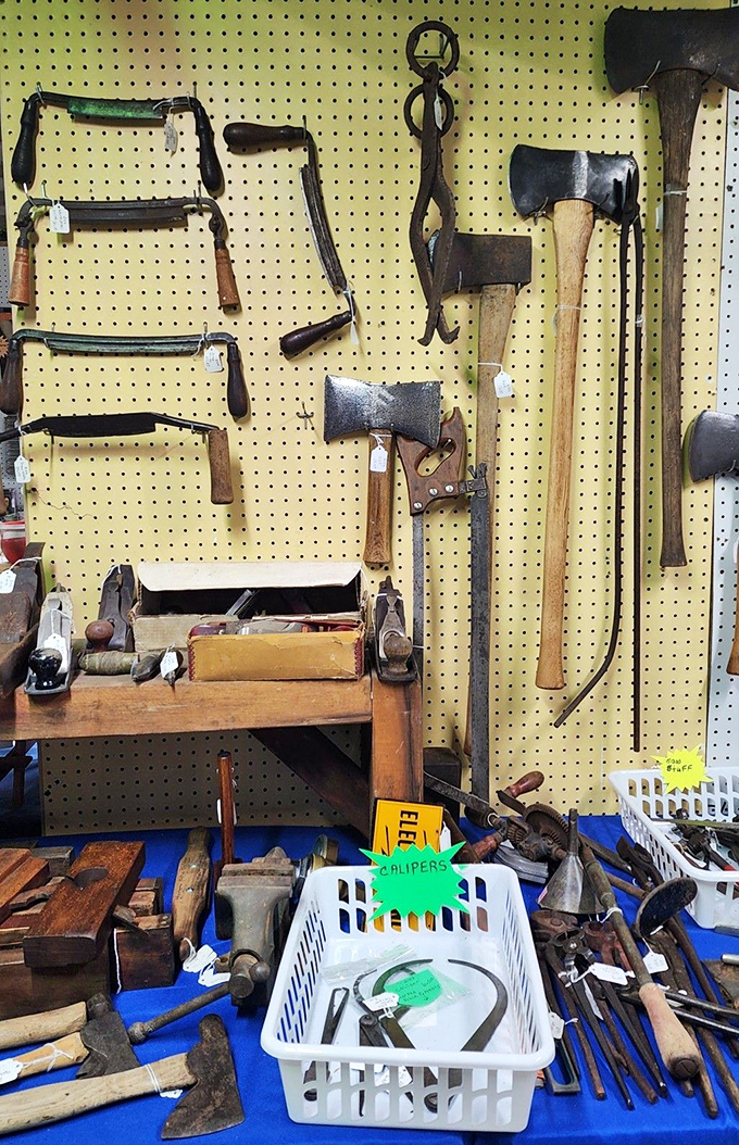 Tools with history hanging on display. Those wooden handles have absorbed the sweat and stories of craftsmen from generations past.