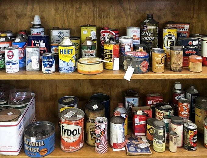 A rainbow of vintage oil cans and automotive products&mdash;proof that even car maintenance was more colorful in the good old days.
