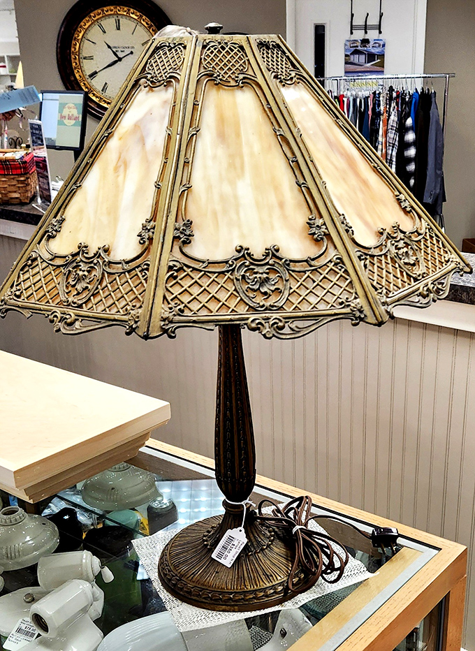 This vintage slag glass lamp belongs in a mystery novel, casting warm shadows across any room.