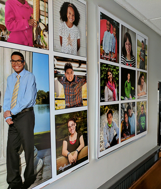 A wall of smiling faces tells the story of community that extends beyond food&mdash;this diner isn't just serving meals, it's creating memories.