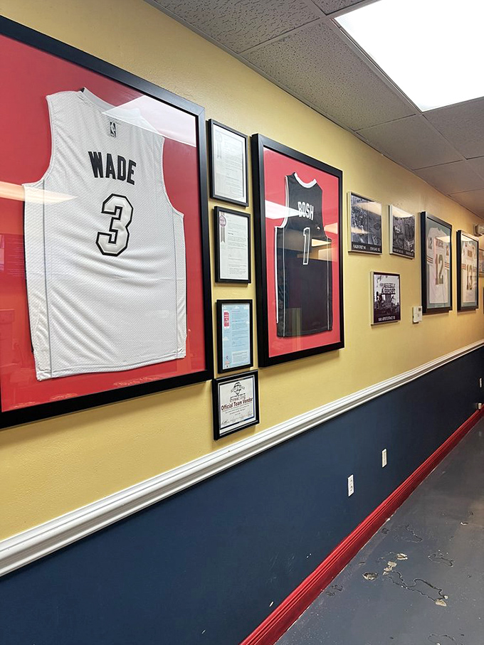 Miami Heat legend Dwyane Wade's jersey holds court on the wall, presiding over a gallery of local sports heroes and hot dog history.