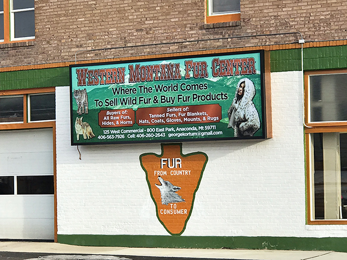 The Western Montana Fur Center sign promises wilderness authenticity in a town where "locally sourced" isn't a marketing trend&mdash;it's just Tuesday.