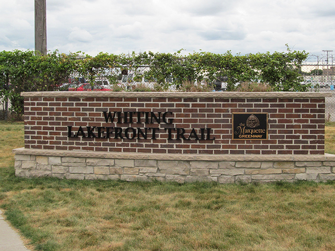 The Whiting Lakefront Trail sign marks the threshold between everyday life and that magical zone where lake views restore your soul.