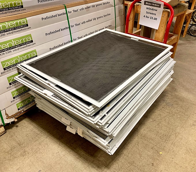 Window screens stacked like pancakes at a sugar shack—practical home improvements that won't drain your maple syrup budget.