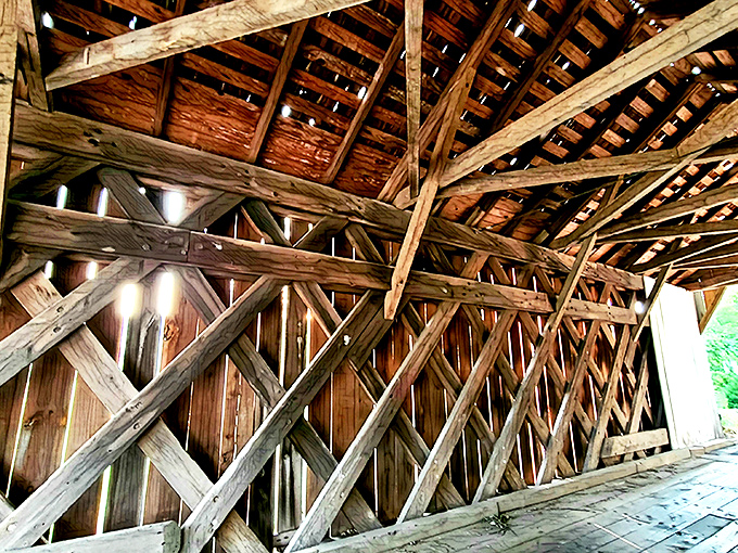 The intricate wooden truss system isn't just functional&mdash;it's a geometric work of art. These diagonal patterns have supported countless crossings since long before calculators existed.
