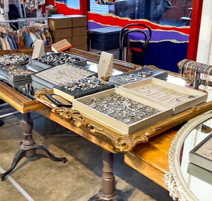 Artisanal jewelry displayed on a vintage table &ndash; where each ring and bracelet waits to become someone's future heirloom or "where did you get that?" conversation starter.