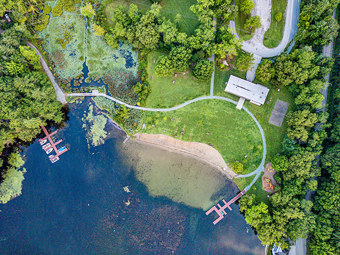 Nature's perfect design from above. This aerial view reveals Bomoseen's thoughtful layout, where beach, dock, and facilities blend seamlessly into the landscape.