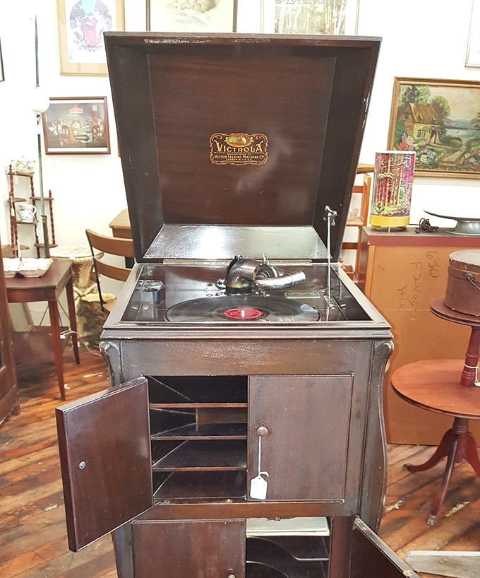 The Victrola stands dignified, waiting for someone to crank its handle and release the ghosts of jazz age parties into the air.