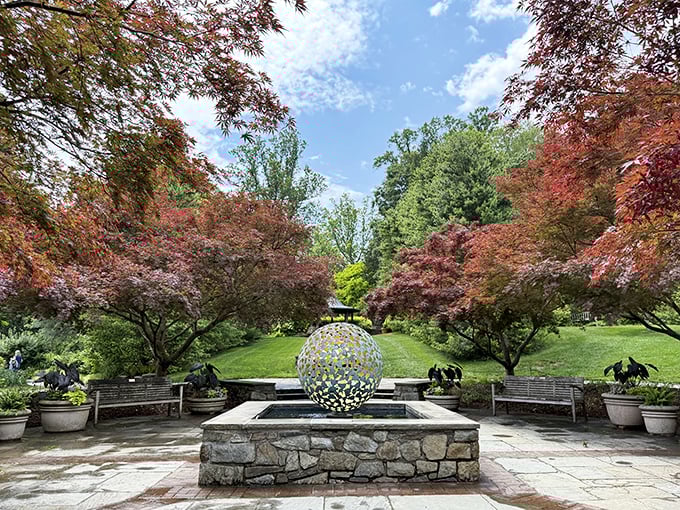 This golden sphere sculpture catches light beautifully, serving as both art installation and conversation starter for wandering visitors.