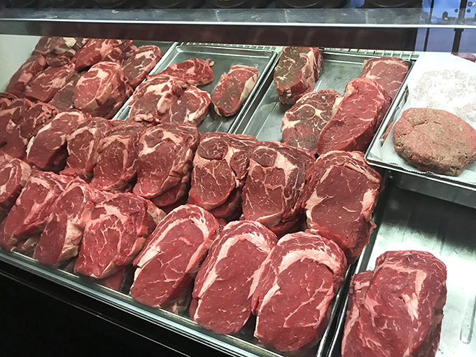 Fresh-cut steaks displayed with pride &ndash; the butcher's showcase that explains why the phrase "melt-in-your-mouth" was invented for places like this.