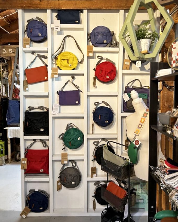 These colorful bags aren't just accessories&mdash;they're portable art pieces, displayed like a rainbow of possibilities against crisp white shelving.