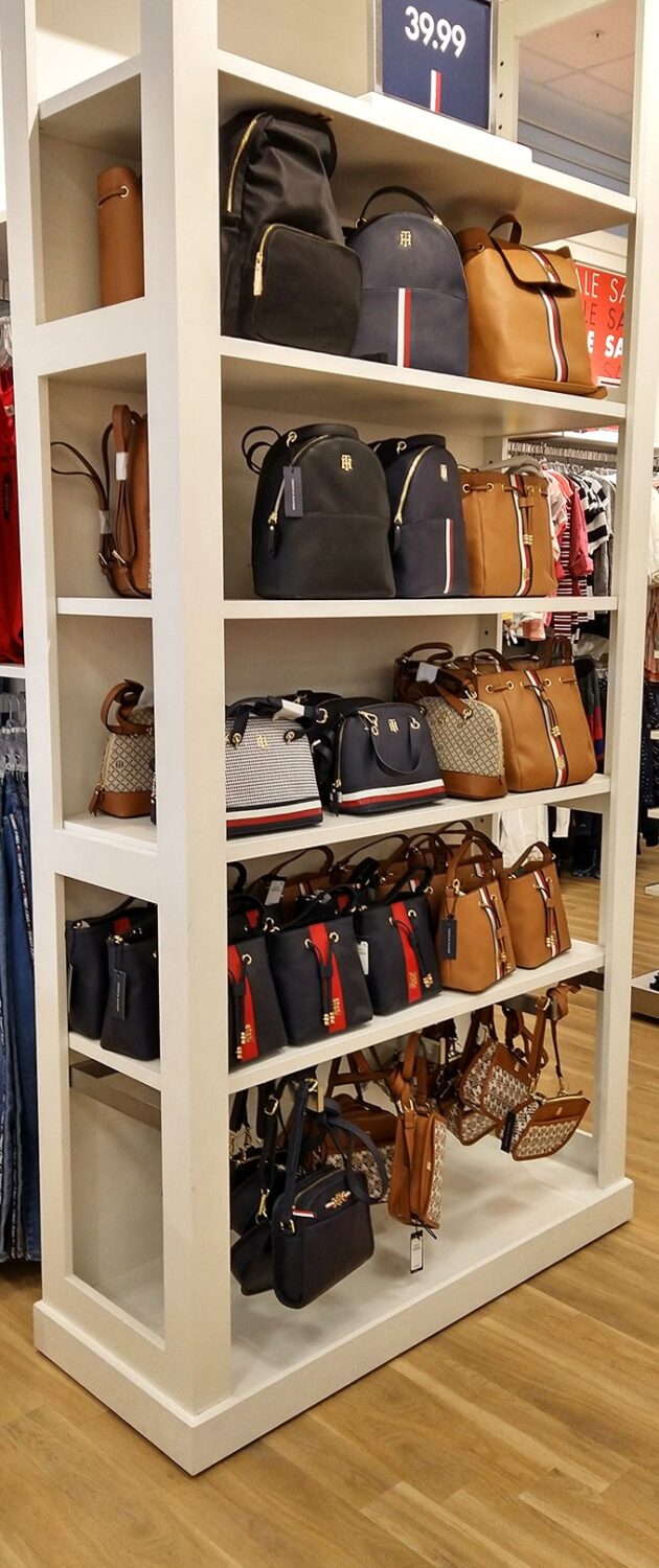 Tommy Hilfiger's handbag display showcases leather goods so tempting you'll find yourself inventing occasions just to carry them.