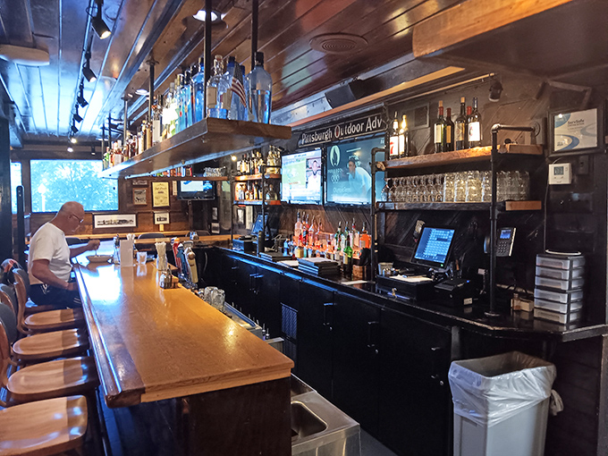 The bar area beckons with the promise of craft beers and spirited conversations, a gathering place where strangers become friends over shared plates.