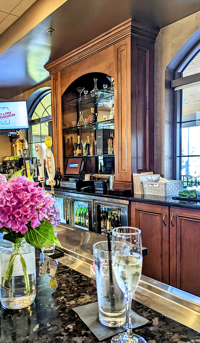The bar area gleams with promise, from fresh flowers to perfectly polished glassware. A civilized spot for a pre-dinner drink or post-sandwich celebration.