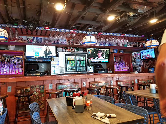 The bar area buzzes with energy, where strangers become friends over shared appetizers and questionable karaoke choices.