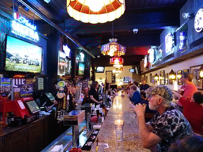 The lively bar area where locals gather to share stories over cold drinks and hot food.