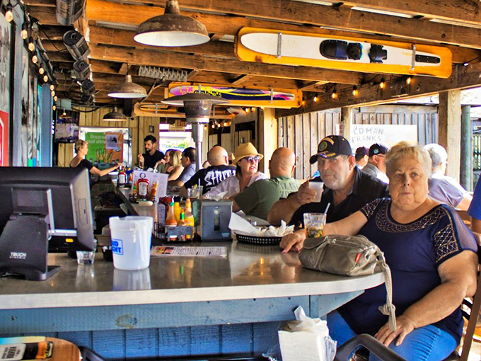The bustling bar area &ndash; where strangers become friends over shared platters of oysters and stories that get better with each telling.