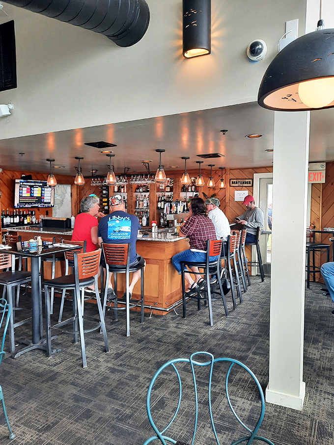 The bar area: where locals share fishing tales and visitors become temporary Mainers over perfectly poured pints.