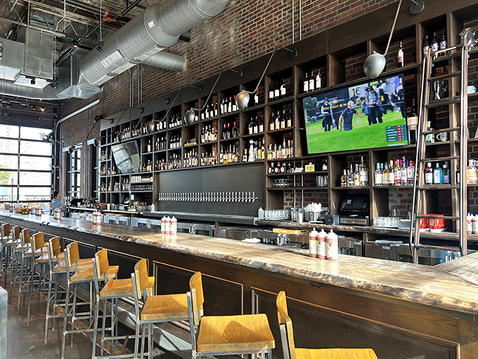 The bar doesn't just serve drinks&mdash;it offers liquid companionship for your meat journey, with bottles standing at attention like soldiers ready for duty.