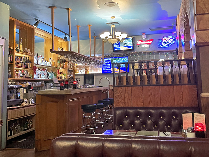 The bar area – where solo diners find community and couples wait for tables, nursing Chianti and anticipation.