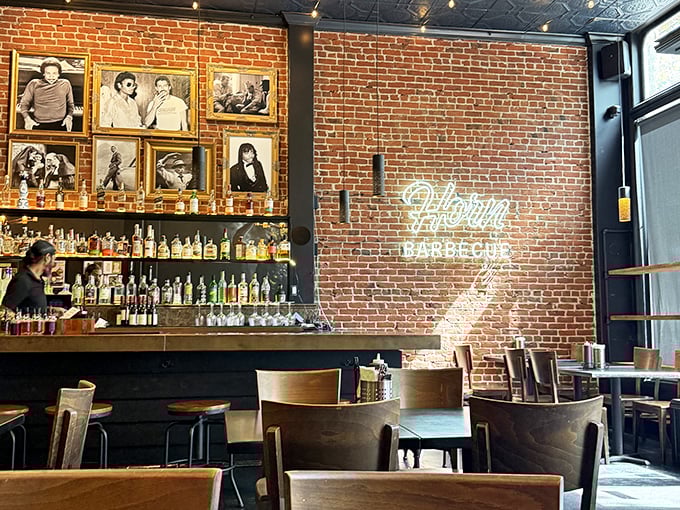 The neon sign glows like a beacon against exposed brick&mdash;a modern temple to traditional techniques that spans generations.